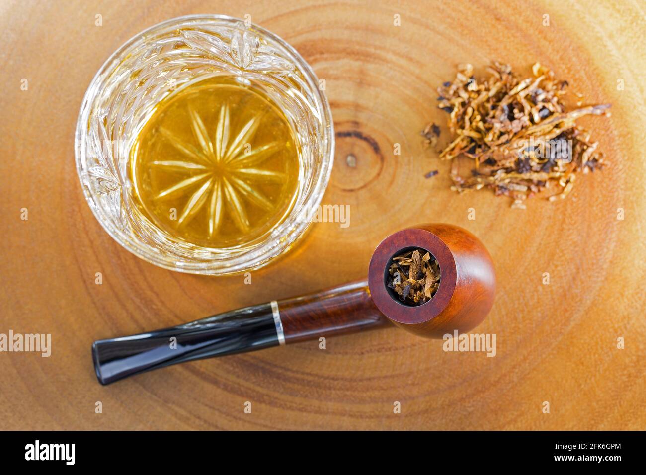 Glass of single malt scotch whisky next to classic blended aromatic ...