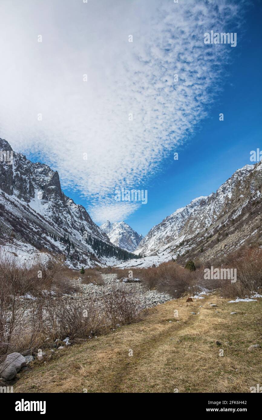 Idyllic winter landscape with hiking trail in the mountains. Rocks ...