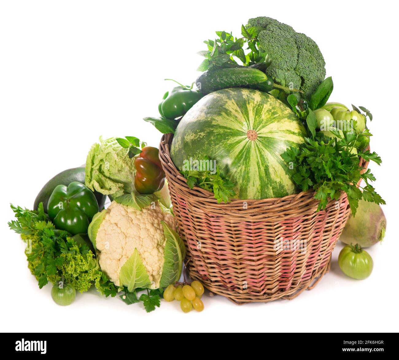 Fresh green vegetables in a wicker basket Stock Photo - Alamy