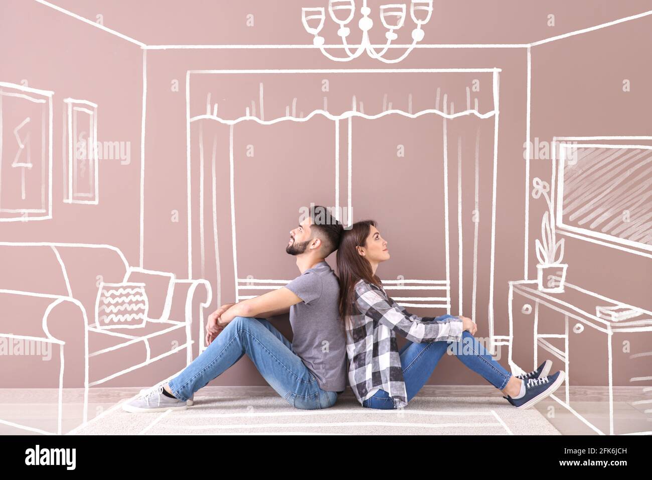 Happy couple planning design of their new house Stock Photo - Alamy