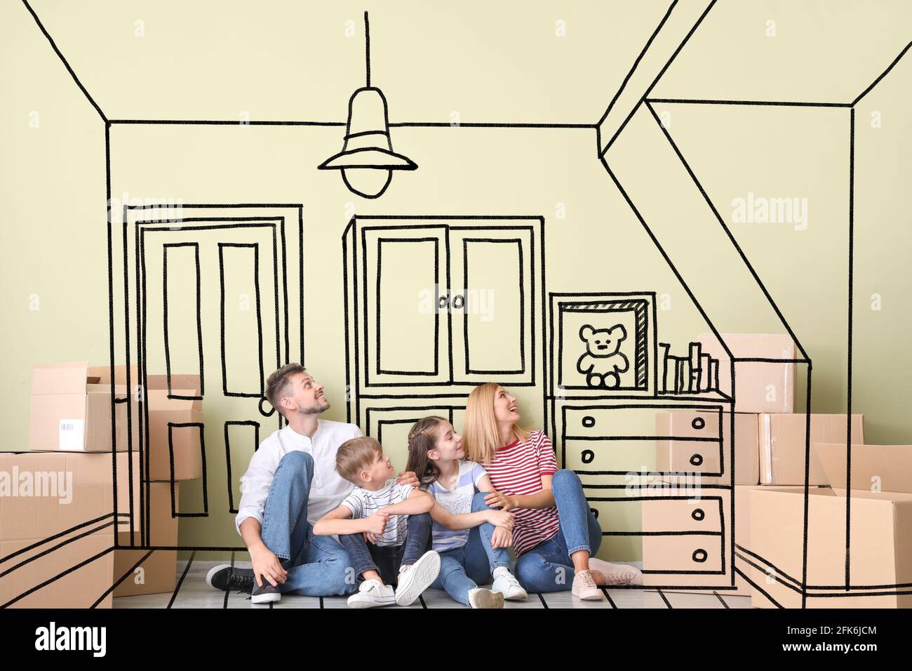 Happy family with belongings thinking about design of their new house ...