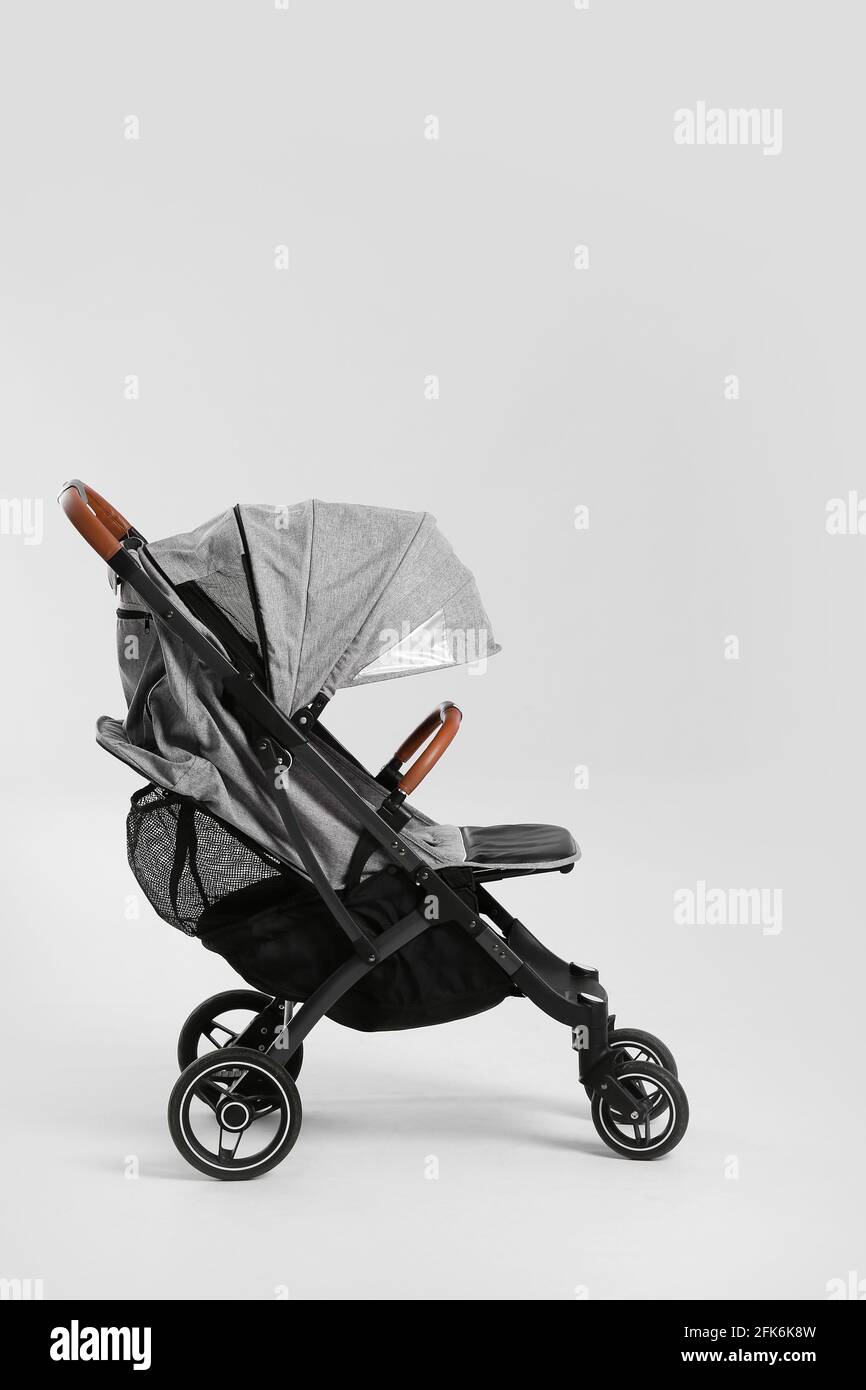 Modern baby stroller on white background Stock Photo - Alamy
