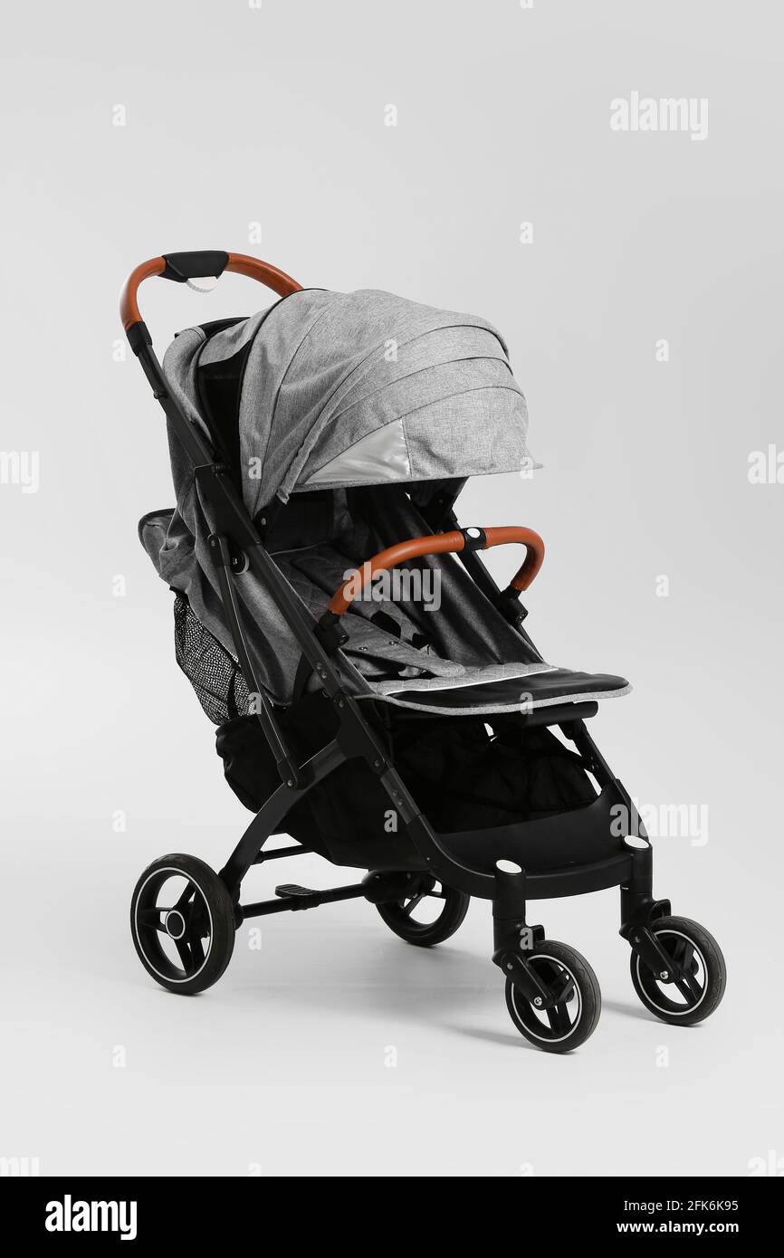Modern baby stroller on white background Stock Photo - Alamy