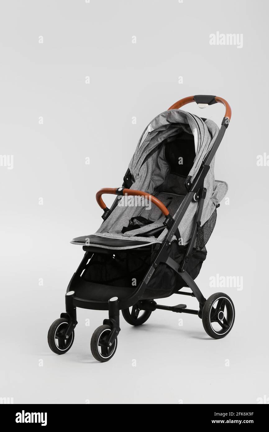 Modern baby stroller on white background Stock Photo - Alamy