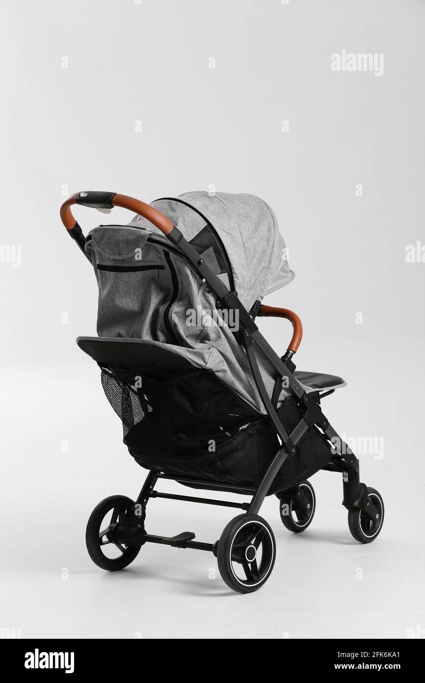 Modern baby stroller on white background Stock Photo - Alamy