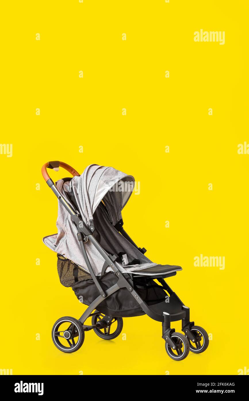 Modern baby stroller on color background Stock Photo - Alamy