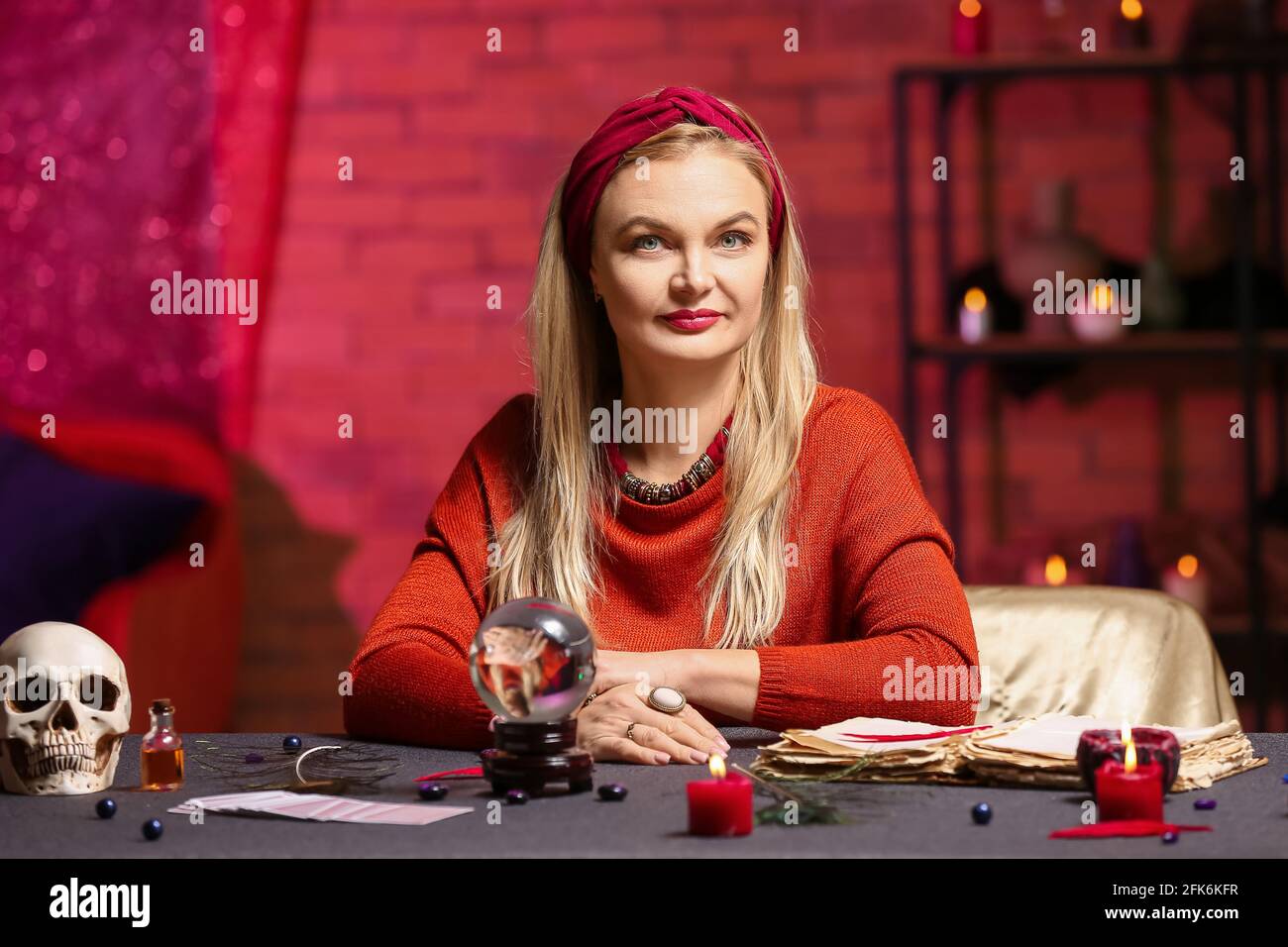 Fortune teller reading future at table Stock Photo - Alamy