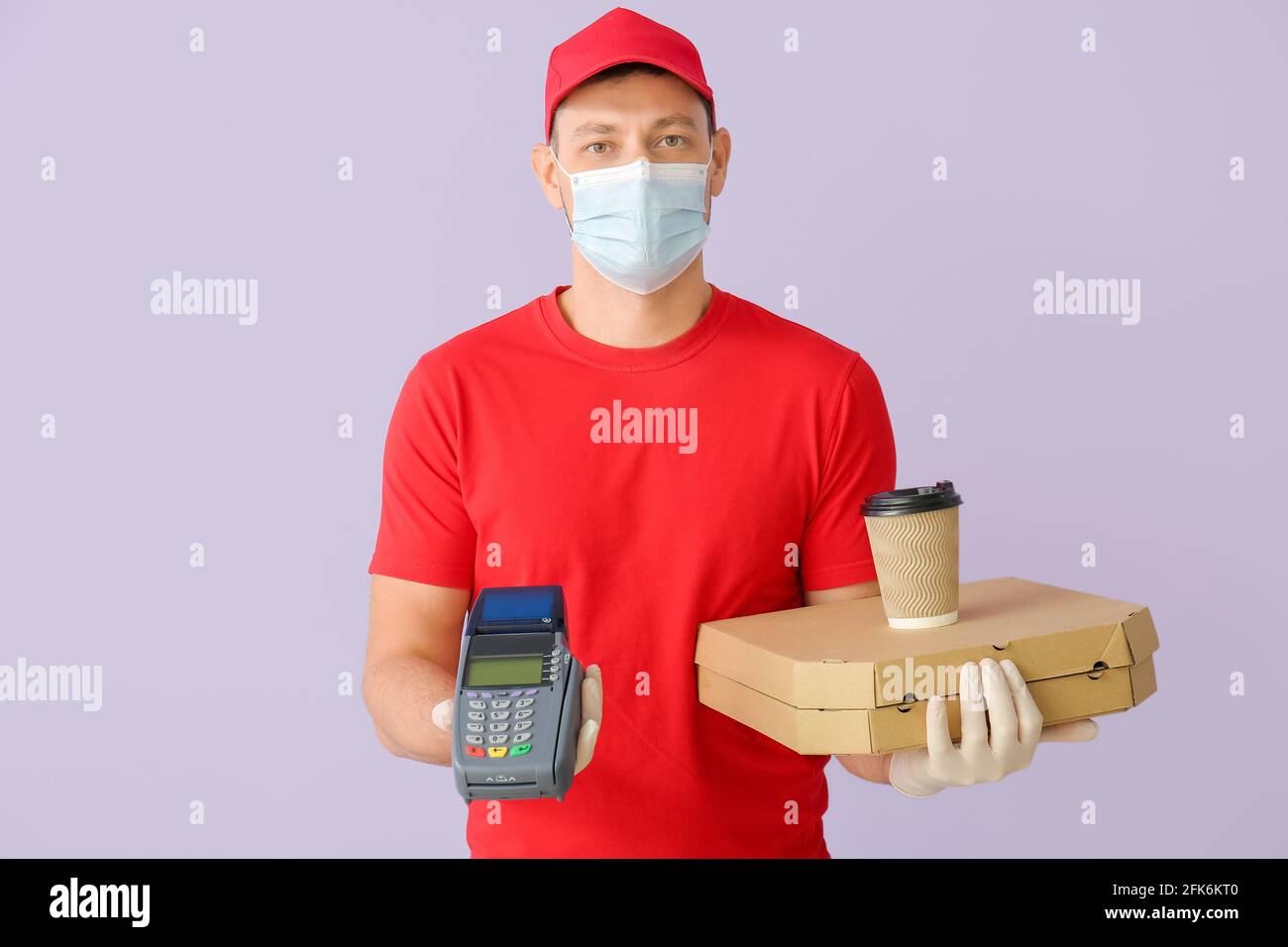 Courier of food delivery service with payment terminal on color ...