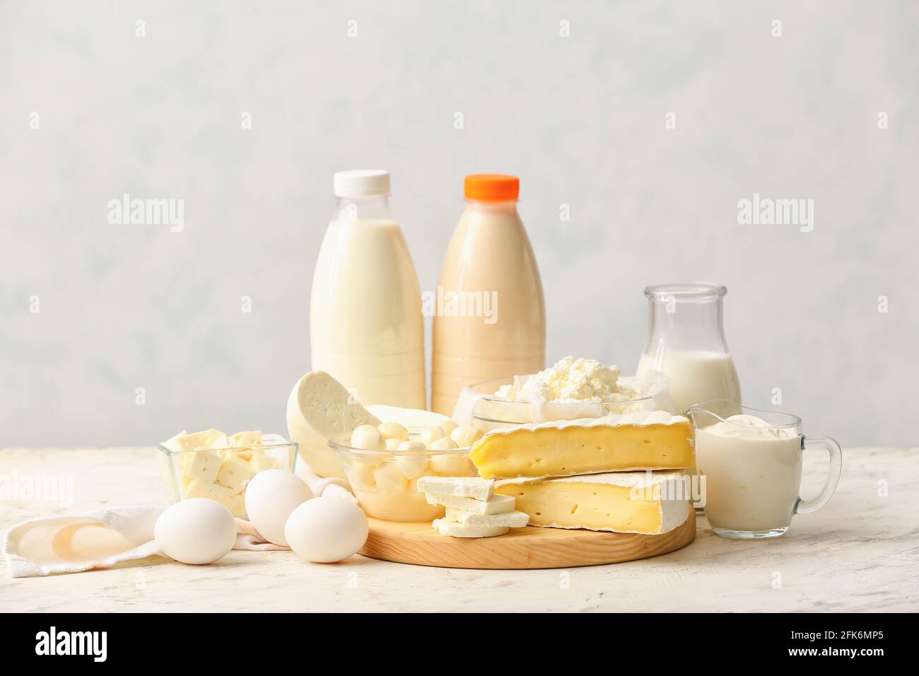 Different dairy products on light background Stock Photo - Alamy