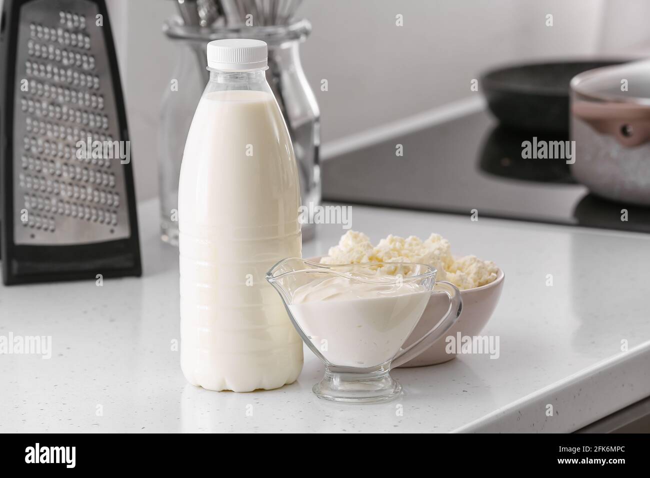 Different dairy products on table in kitchen Stock Photo - Alamy