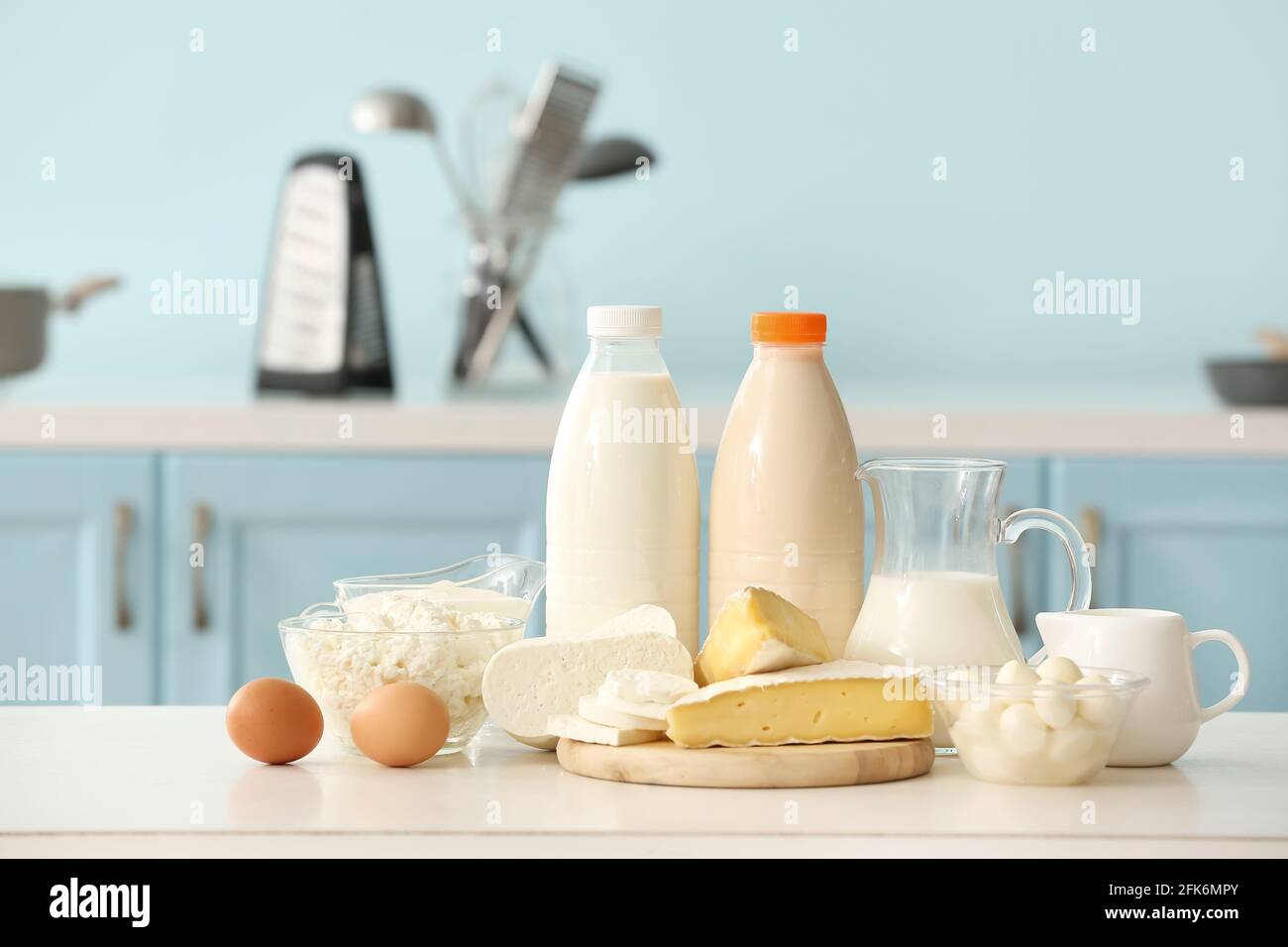 Different dairy products on table in kitchen Stock Photo - Alamy
