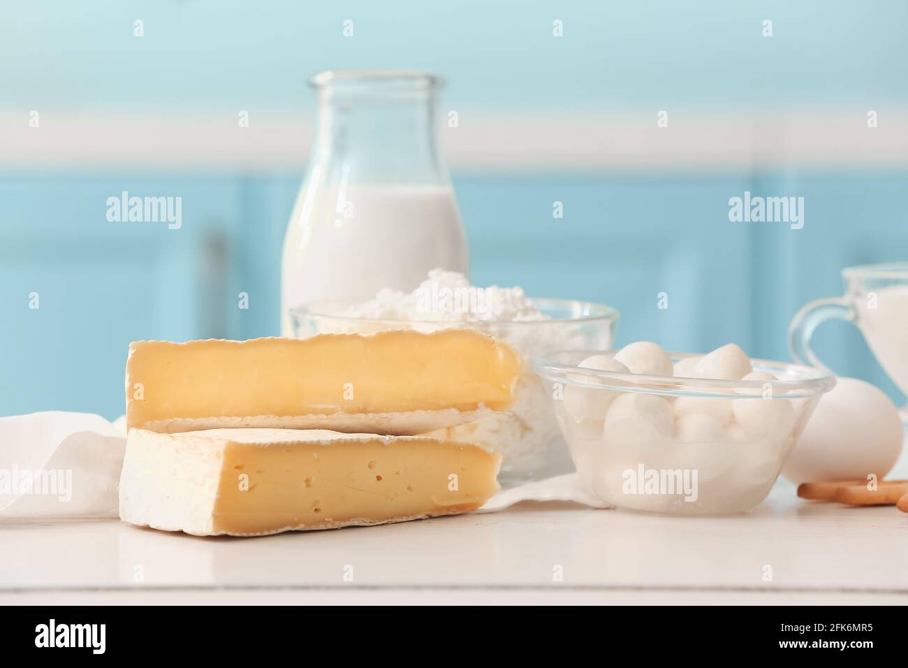 Different dairy products on table in kitchen Stock Photo - Alamy