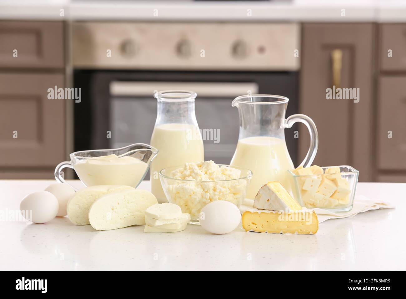 Different dairy products on table in kitchen Stock Photo - Alamy