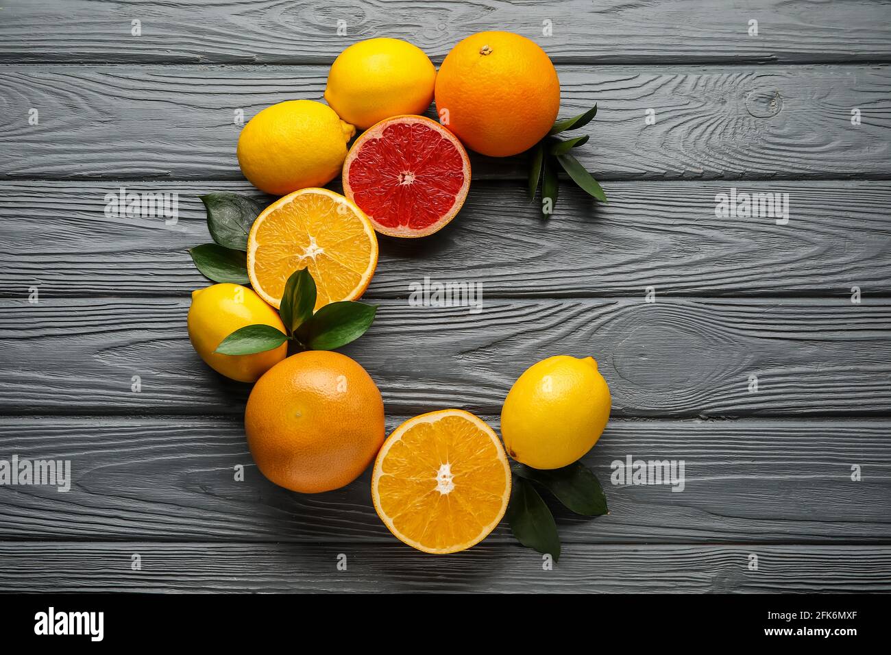 Letter C made of citrus fruits on dark wooden background Stock Photo ...
