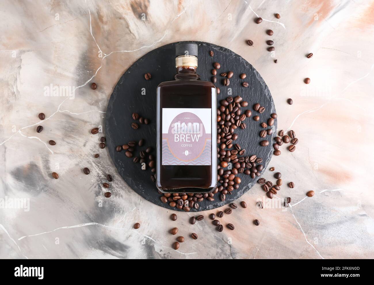 Bottle of cold brew and coffee beans on grunge background Stock Photo ...