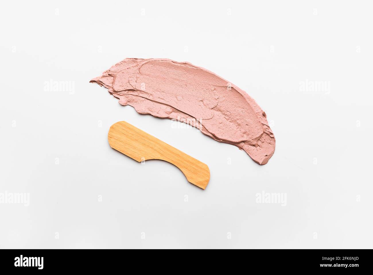 Sample of cosmetic clay and wooden spatula on white background Stock ...