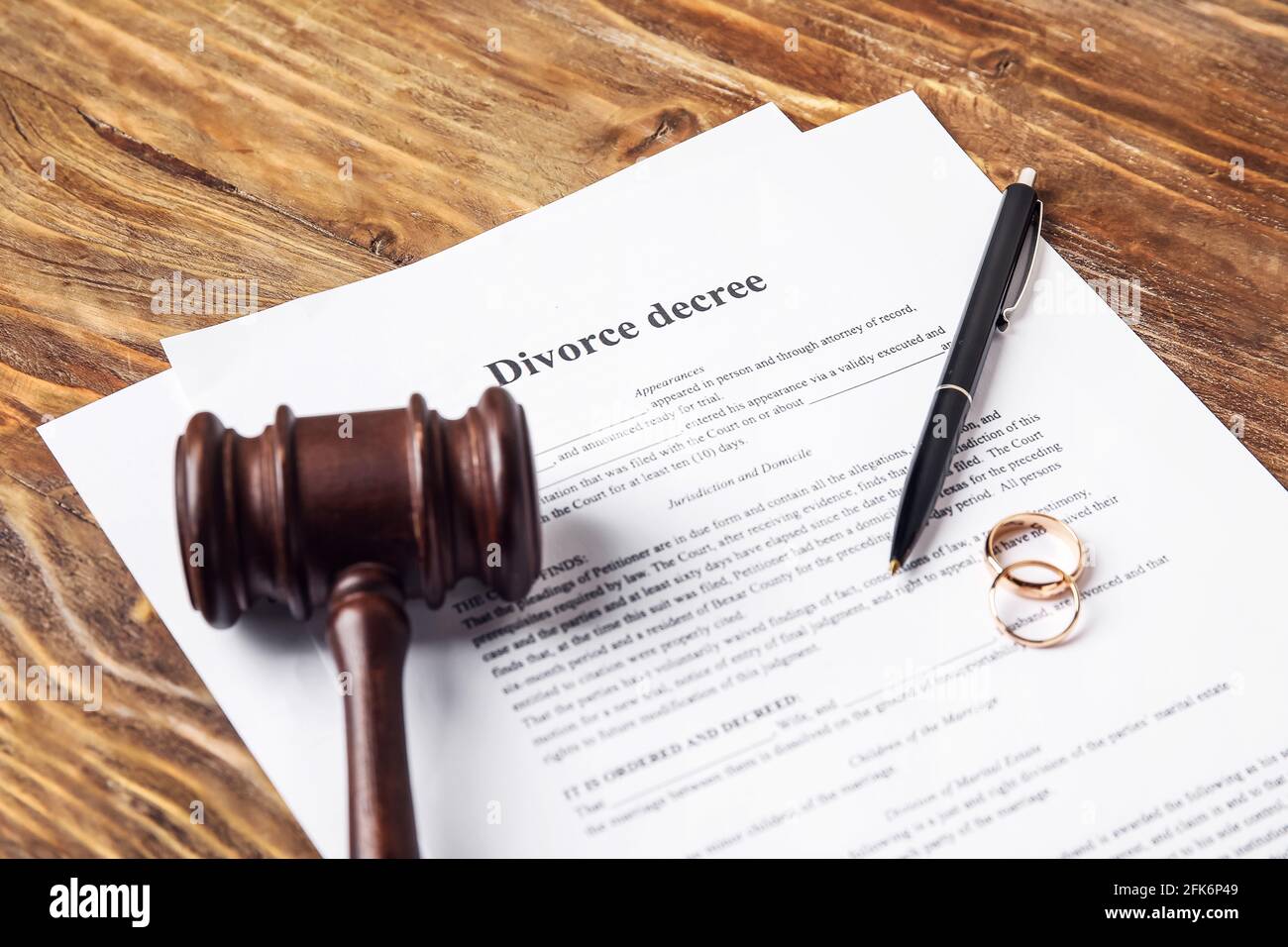 Divorce decree with judge's gavel and rings on wooden background Stock ...