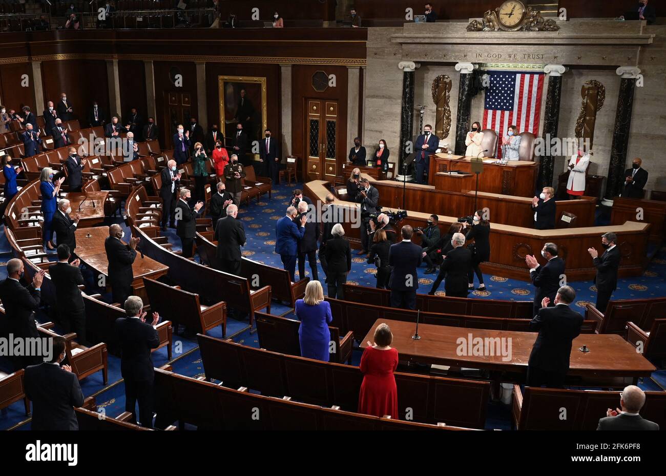 US President Joe Biden (C) arrives to addresses a joint session of ...