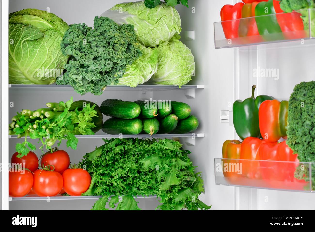 Fresh vegetables in open fridge, closeup Stock Photo - Alamy