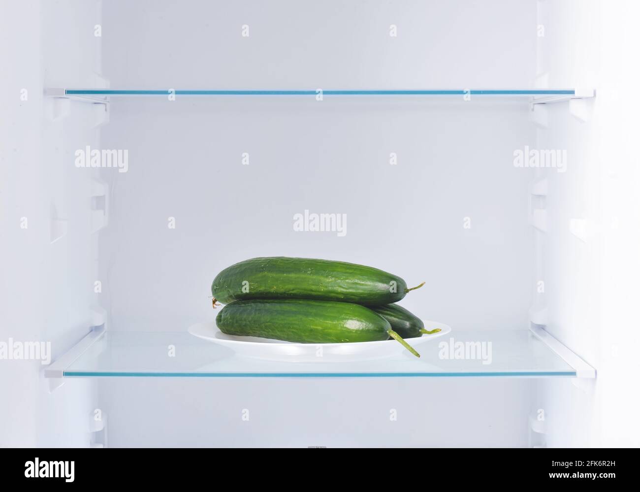 Fresh cucumbers in empty fridge Stock Photo - Alamy