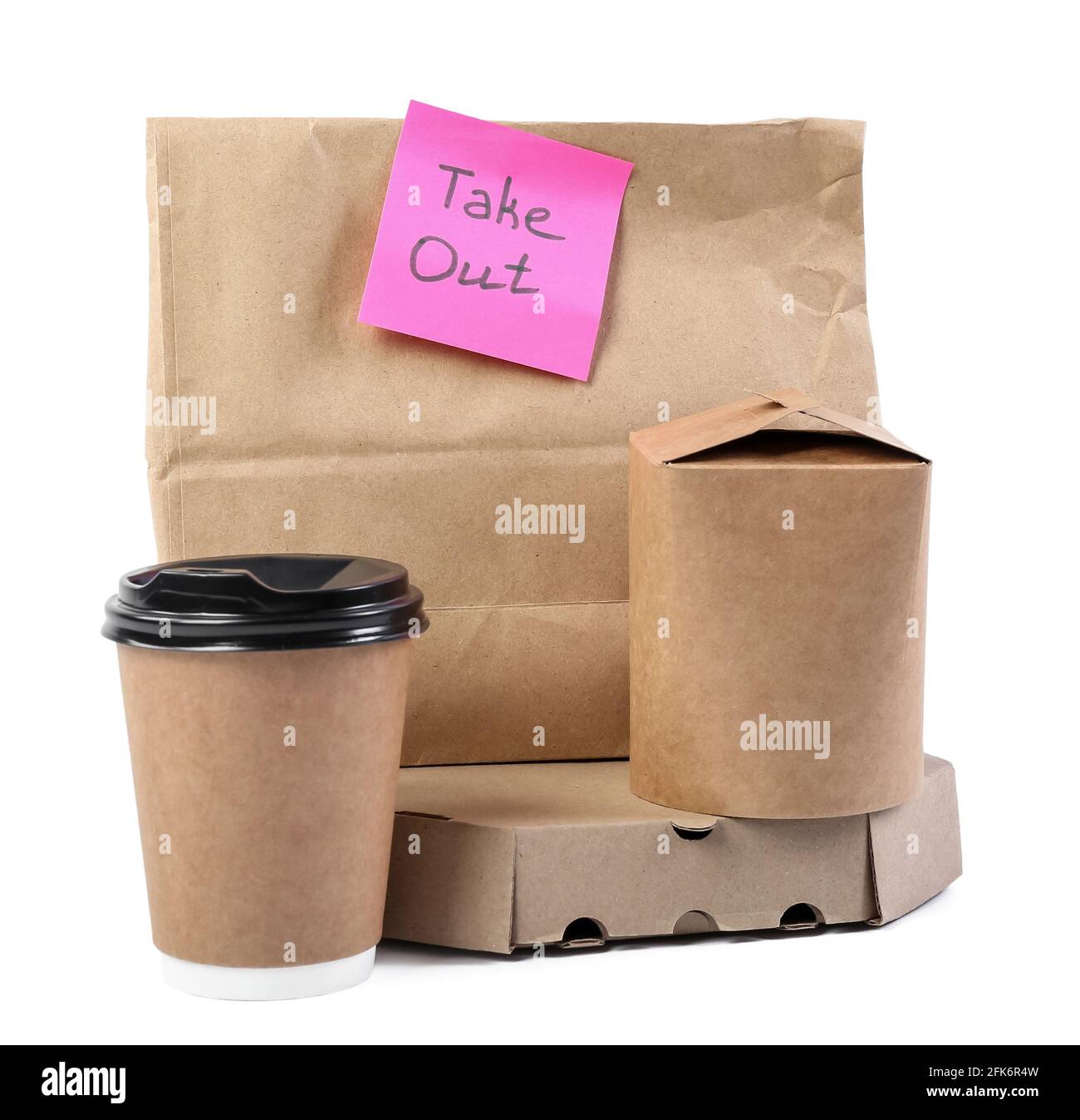 Paper bag with sticker TAKE OUT, boxes for food and cup on white ...