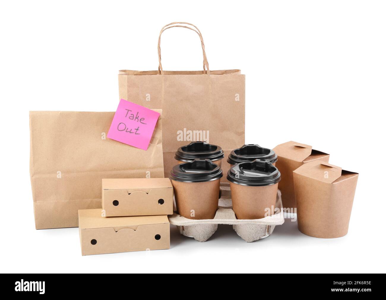 Paper bags with sticker TAKE OUT, boxes for food and cups on white ...