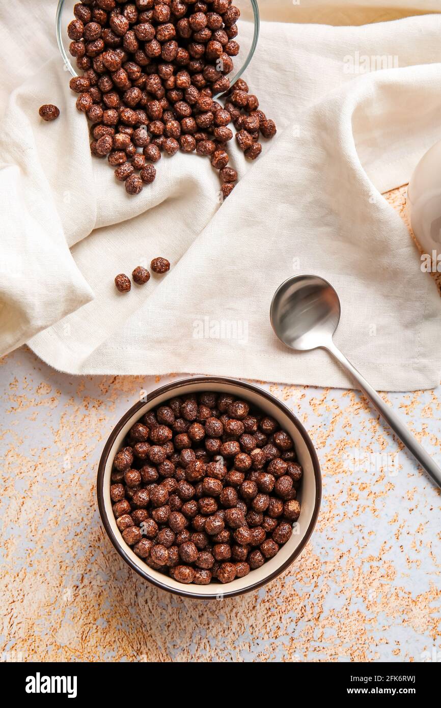Bowl with chocolate corn balls on light background Stock Photo - Alamy