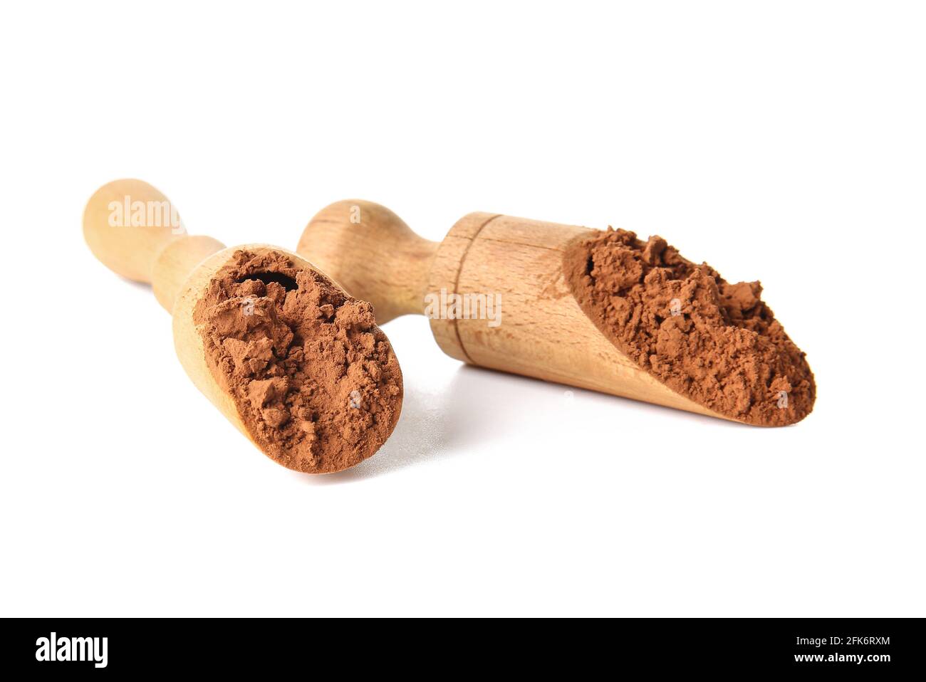 Scoops with cocoa powder on white background Stock Photo - Alamy