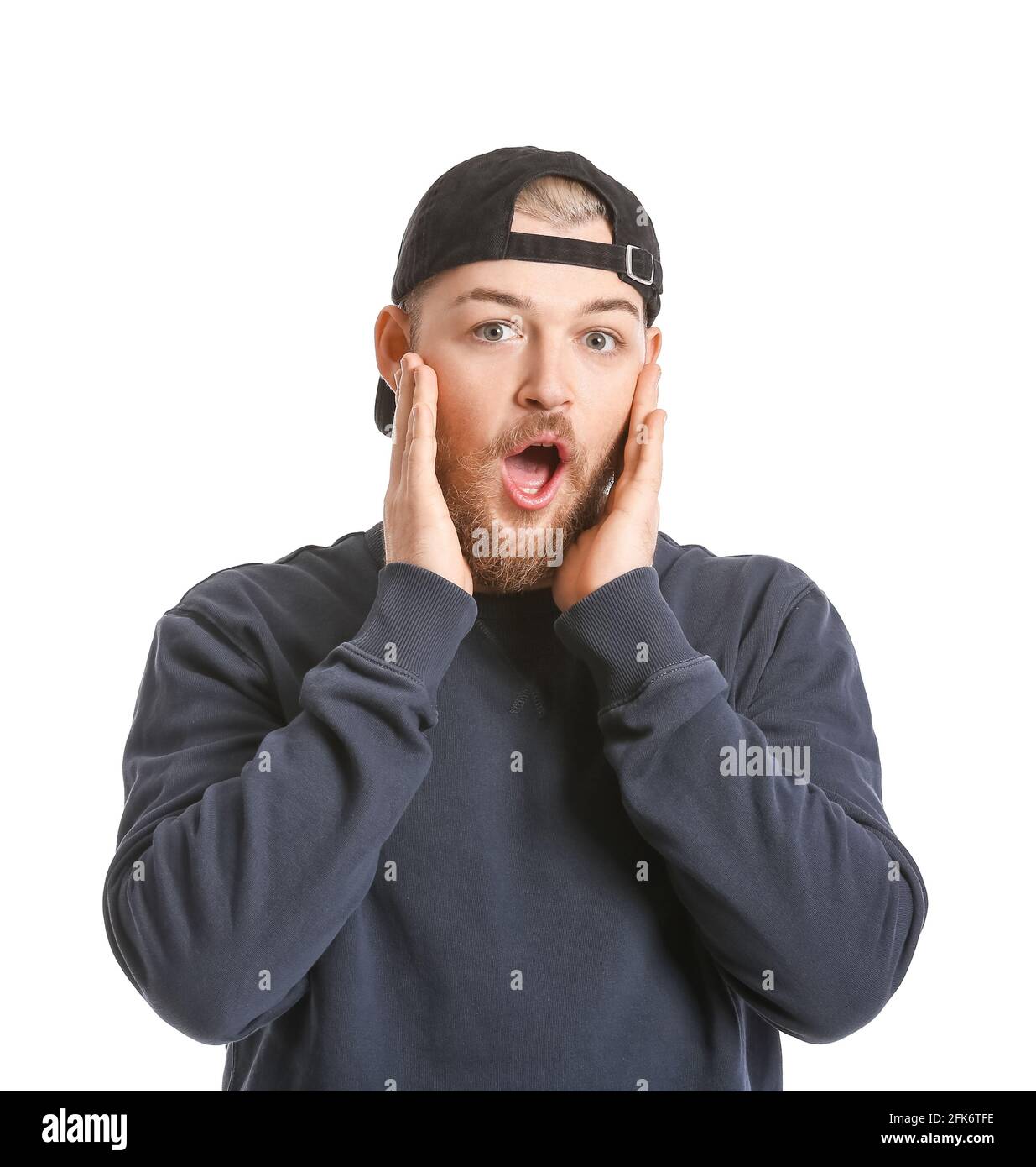 Shocked handsome man on white background Stock Photo - Alamy