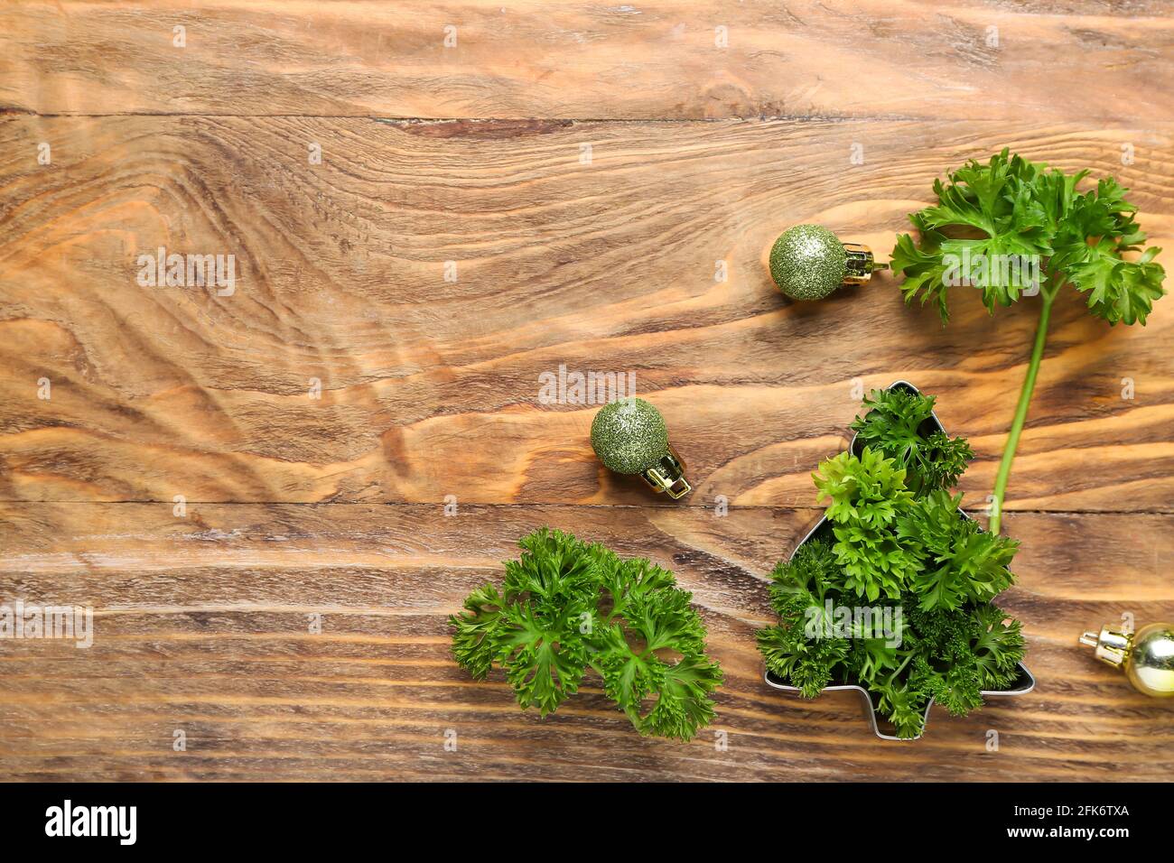 Fresh parsley and Christmas decor on wooden background Stock Photo - Alamy