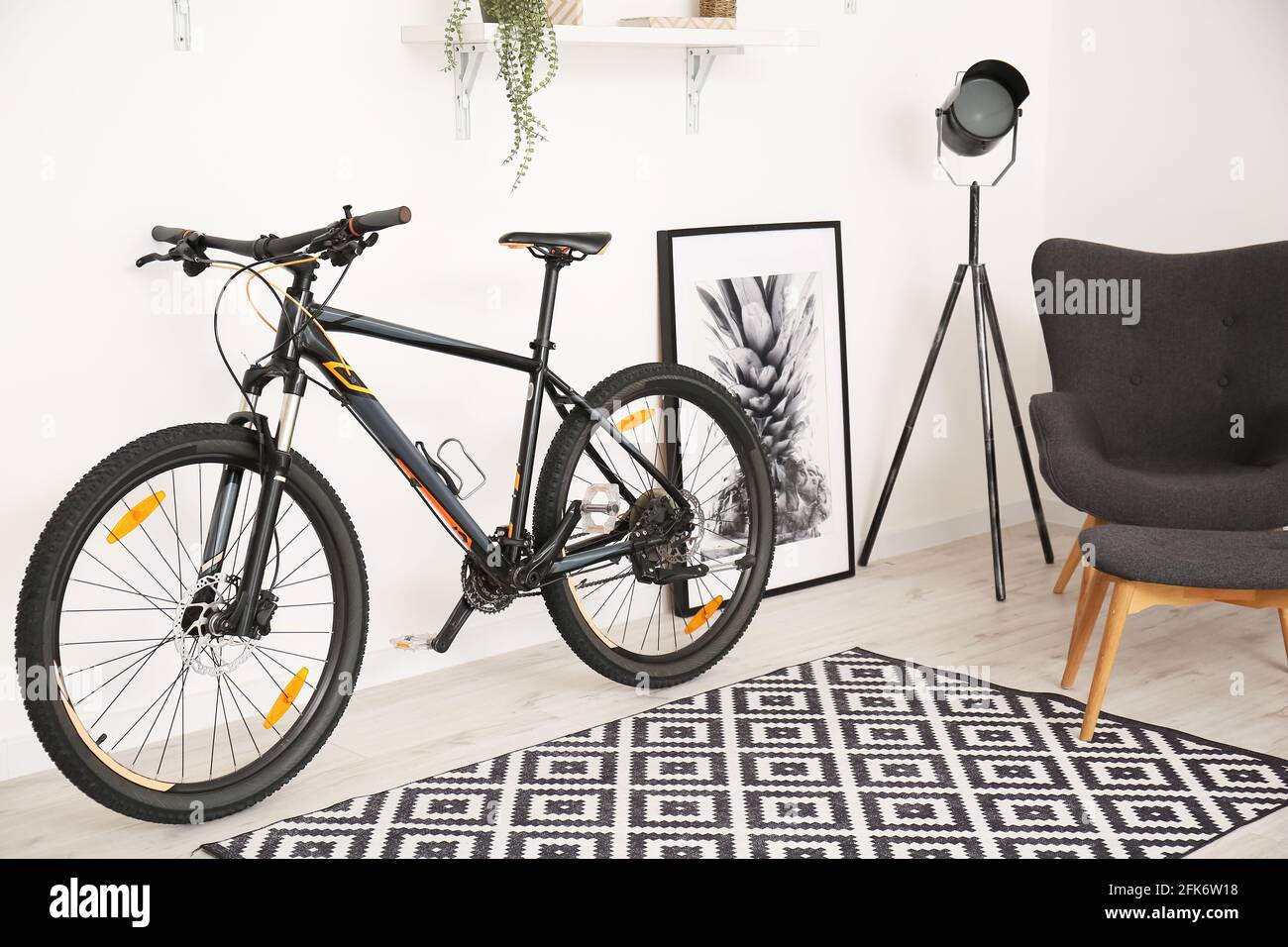 Bicycle in interior of modern room Stock Photo - Alamy