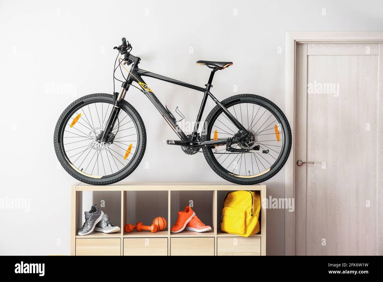 Modern bicycle in interior of room Stock Photo - Alamy