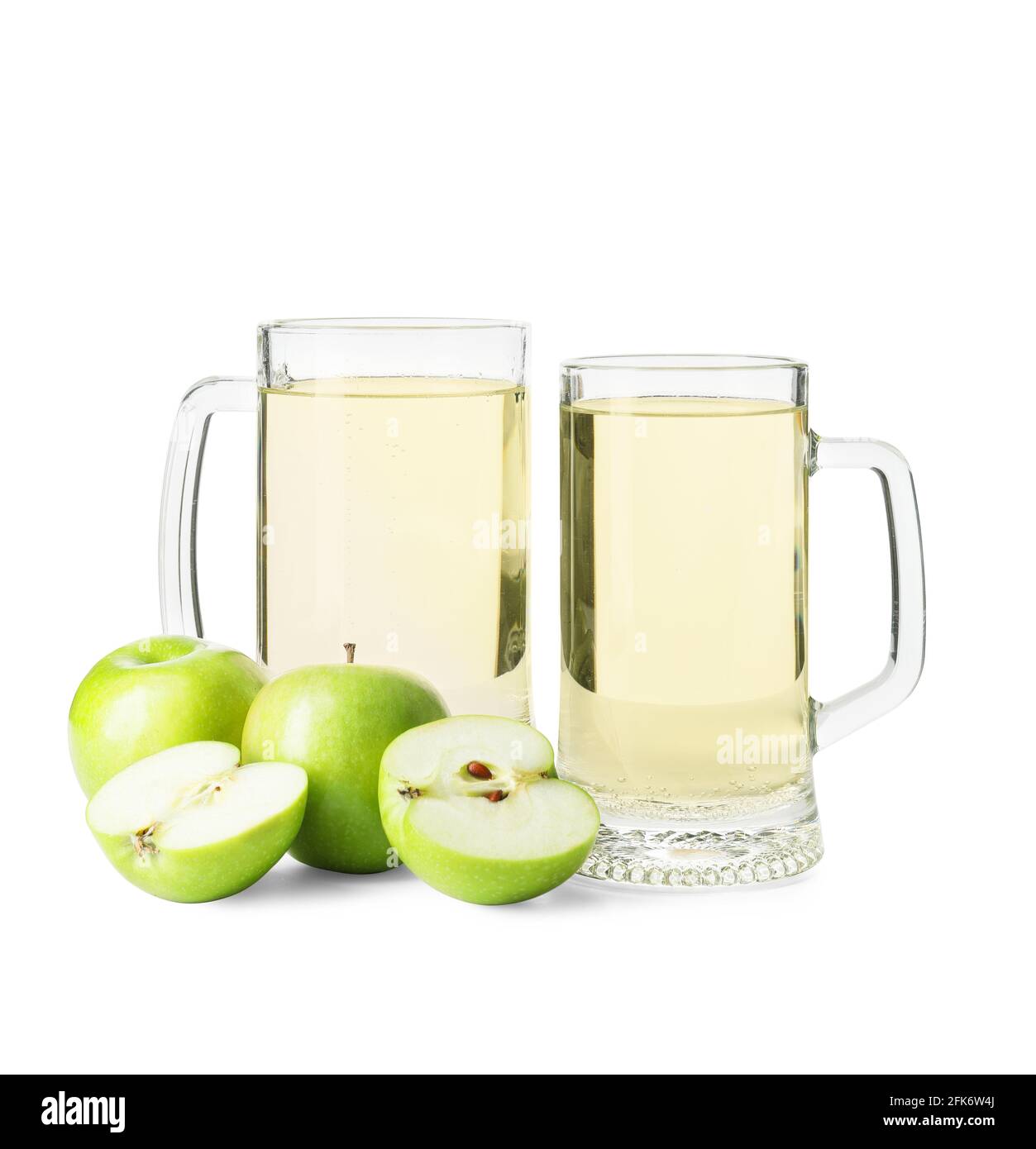 Mugs of apple cider on white background Stock Photo - Alamy