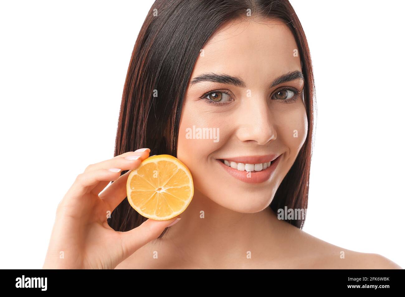 Beautiful young woman with lemon on white background Stock Photo - Alamy