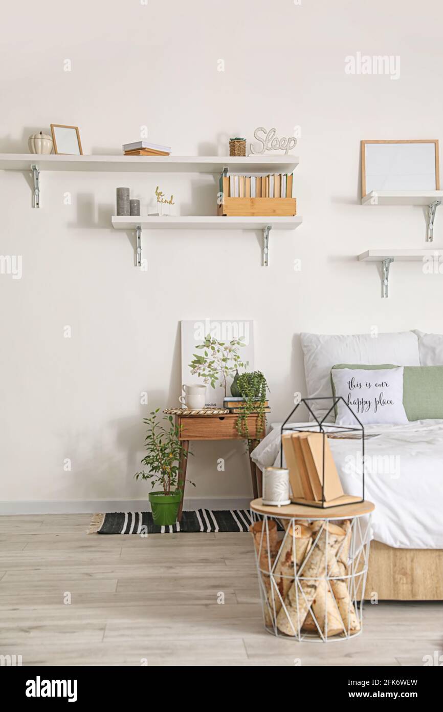 Bedside tables with decor in interior of modern room Stock Photo - Alamy