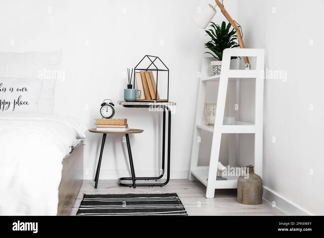 Bedside tables with decor in interior of modern room Stock Photo - Alamy