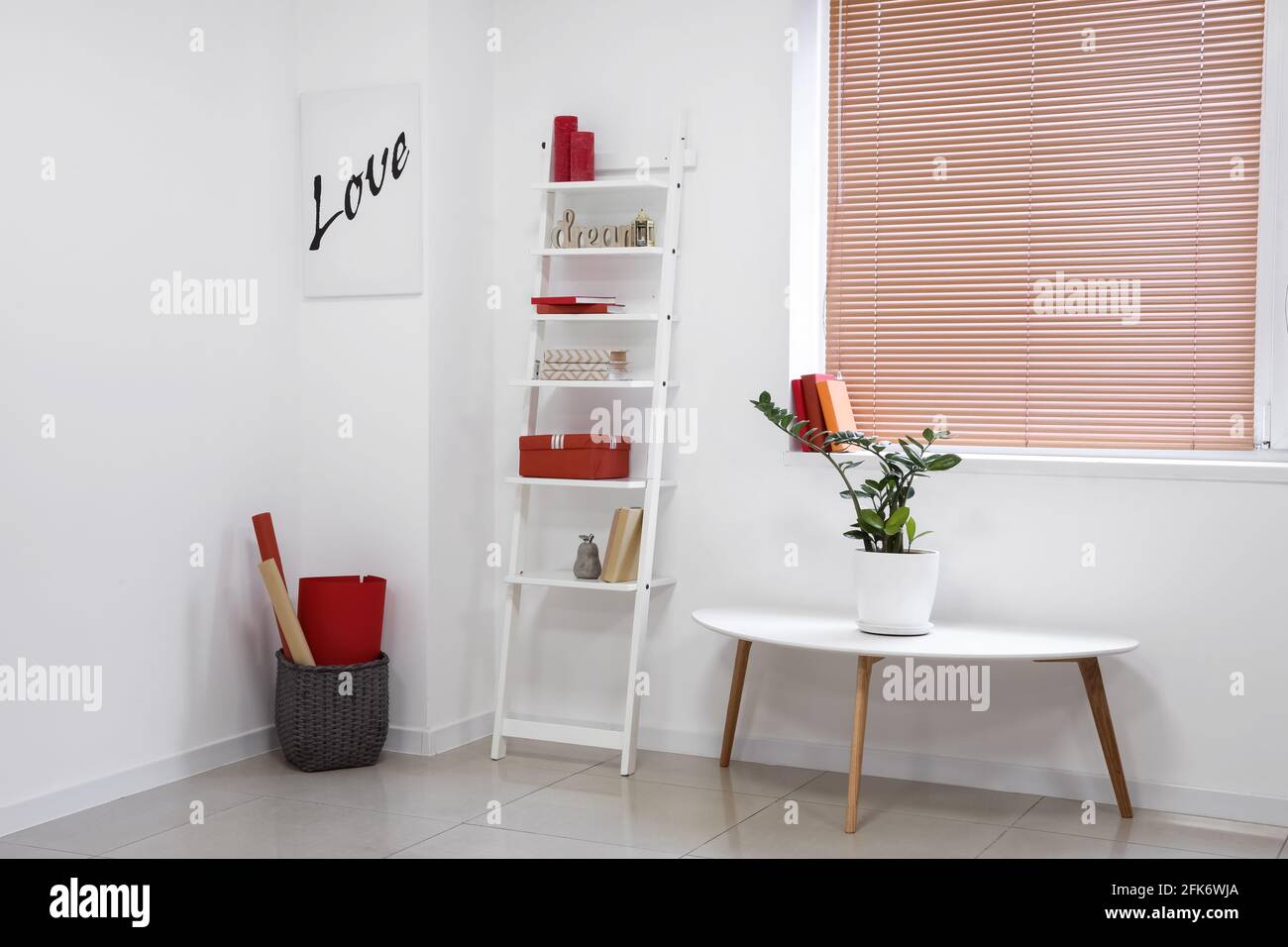 Interior of modern room with shelf unit and table Stock Photo - Alamy