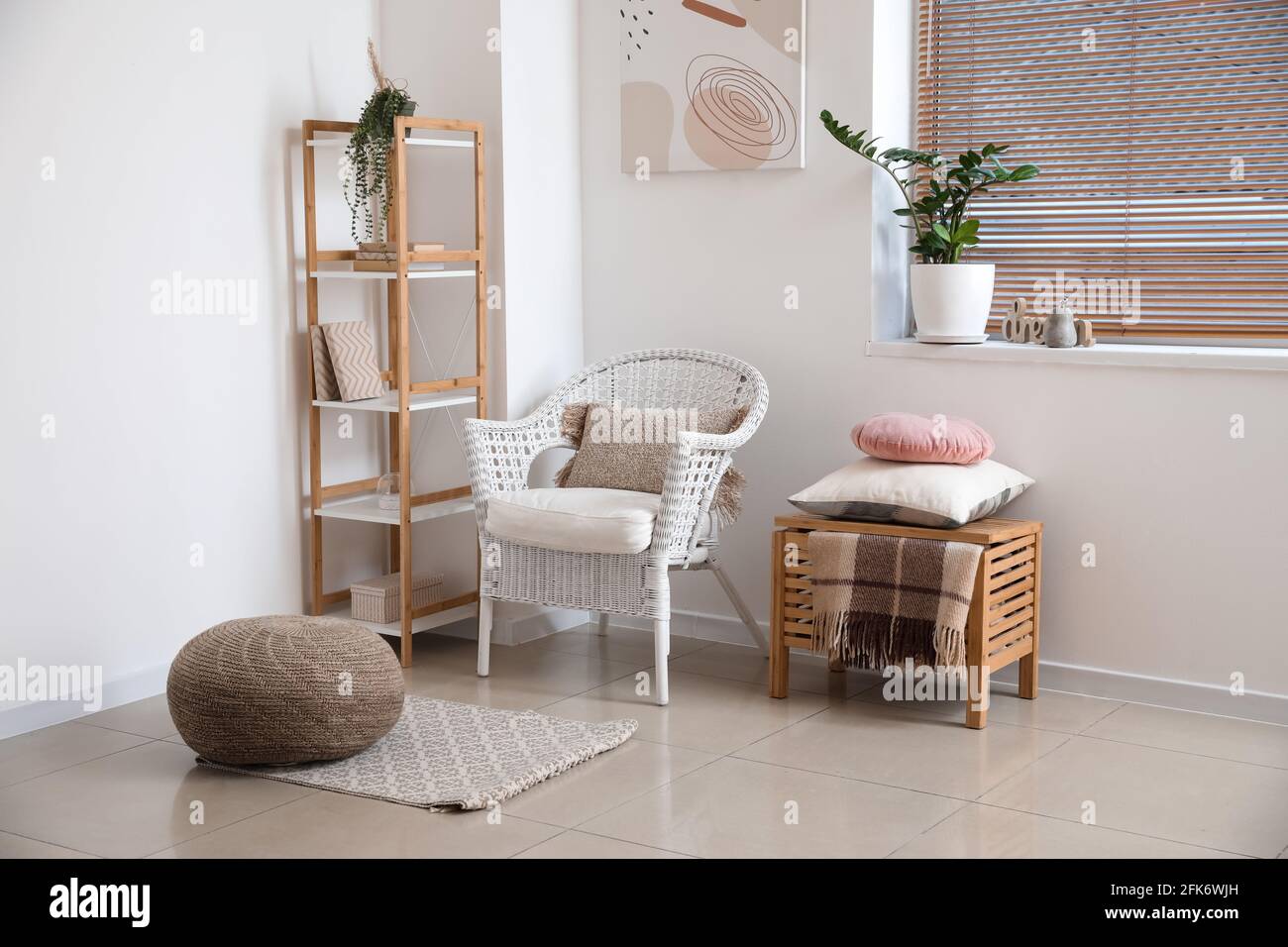 Interior of modern room with shelf unit and chair Stock Photo - Alamy