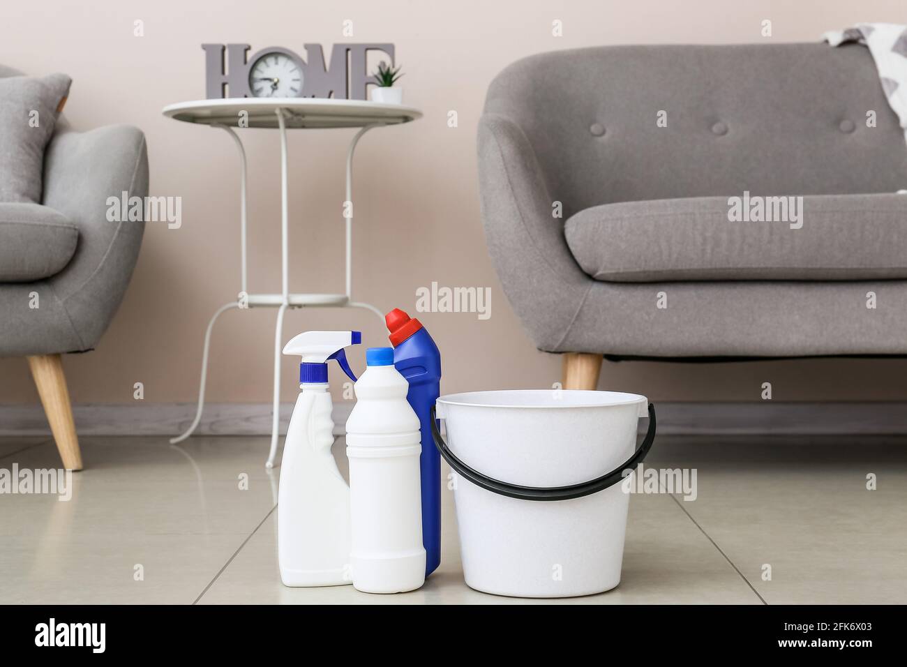 Set of cleaning supplies in room Stock Photo - Alamy
