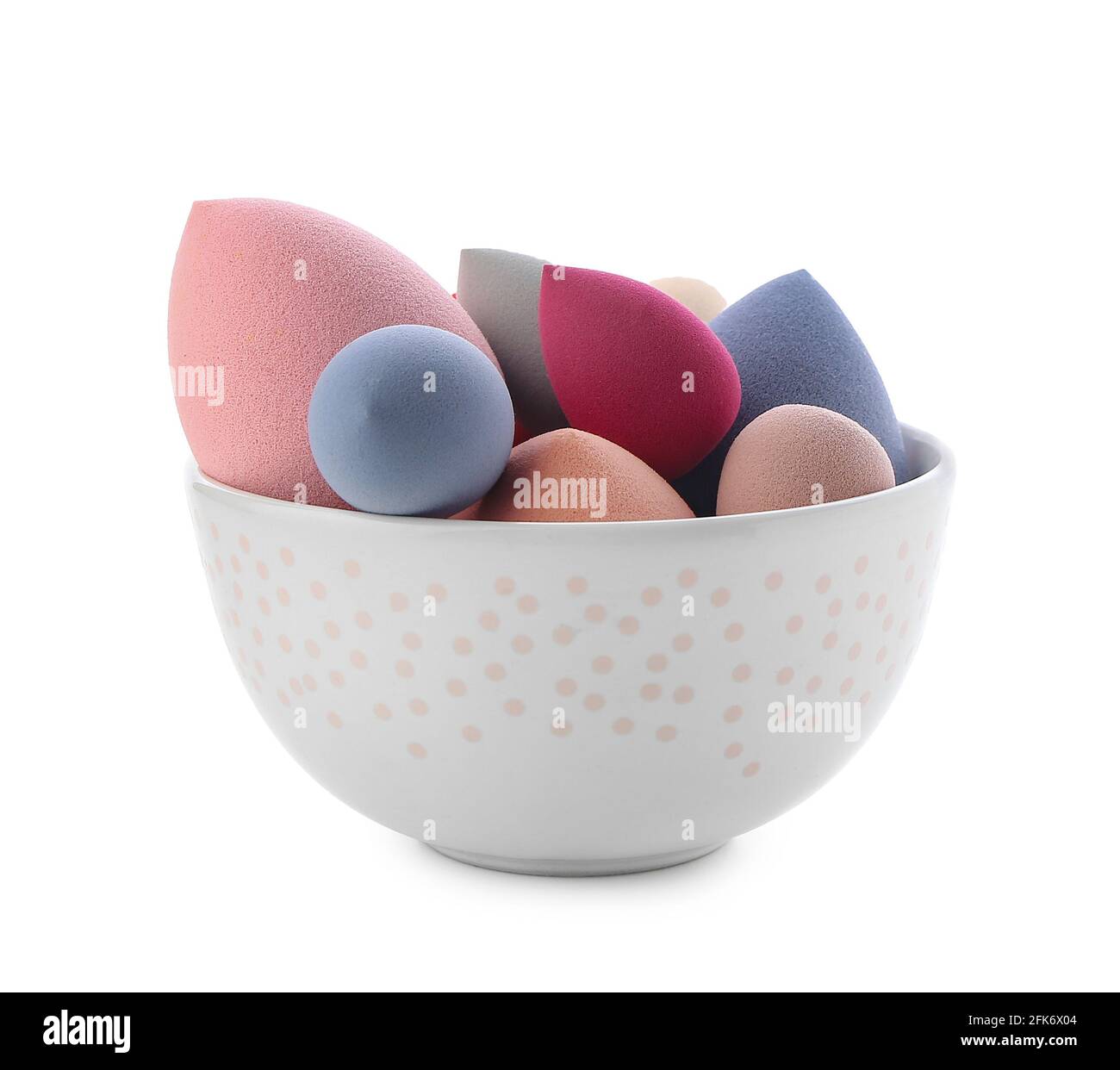 Bowl with makeup sponges on white background Stock Photo - Alamy