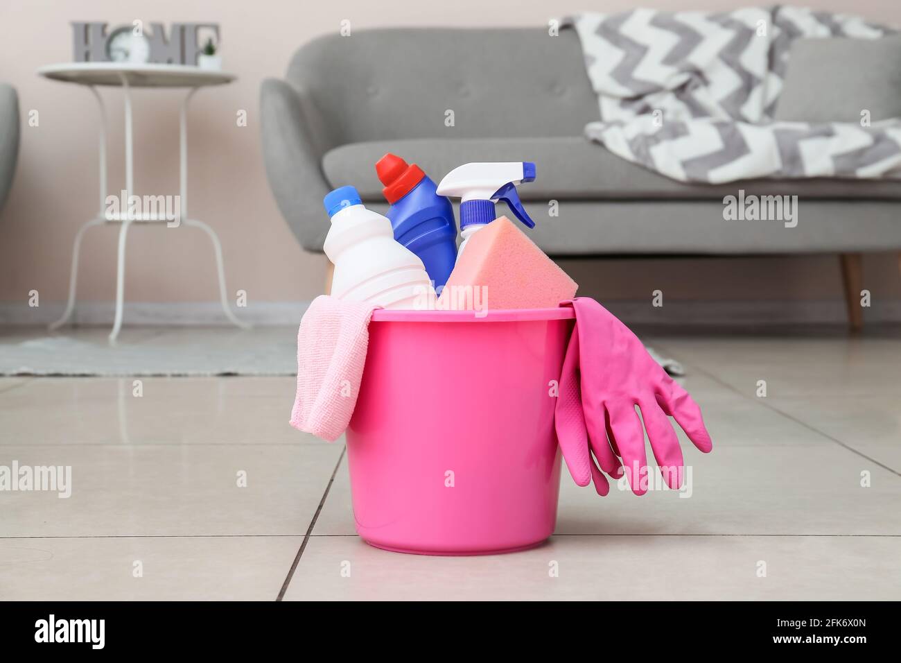 Set of cleaning supplies in room Stock Photo - Alamy