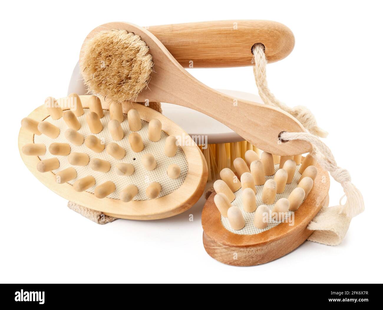 Different massage brushes on white background Stock Photo - Alamy