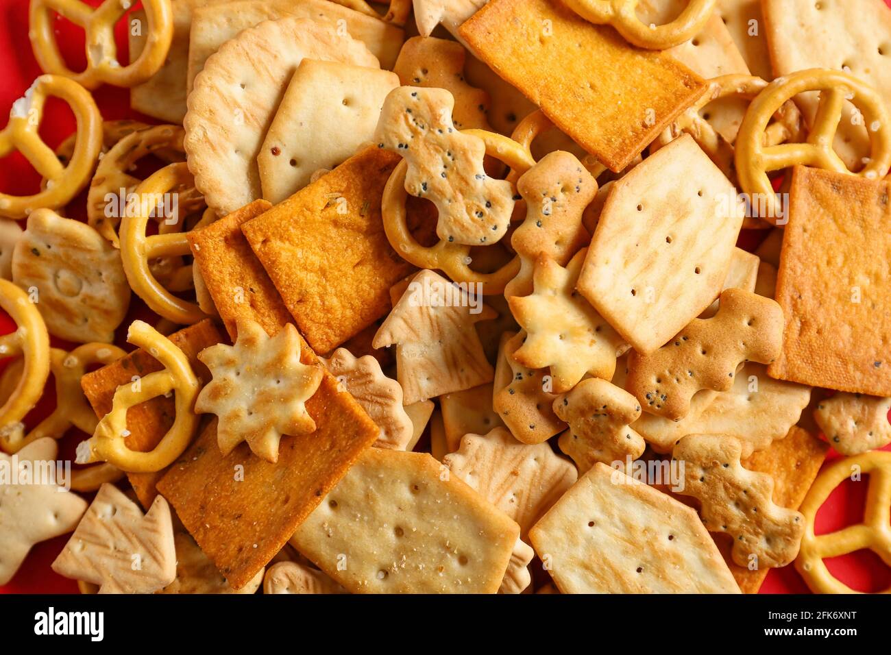 Tasty different crackers as background Stock Photo - Alamy