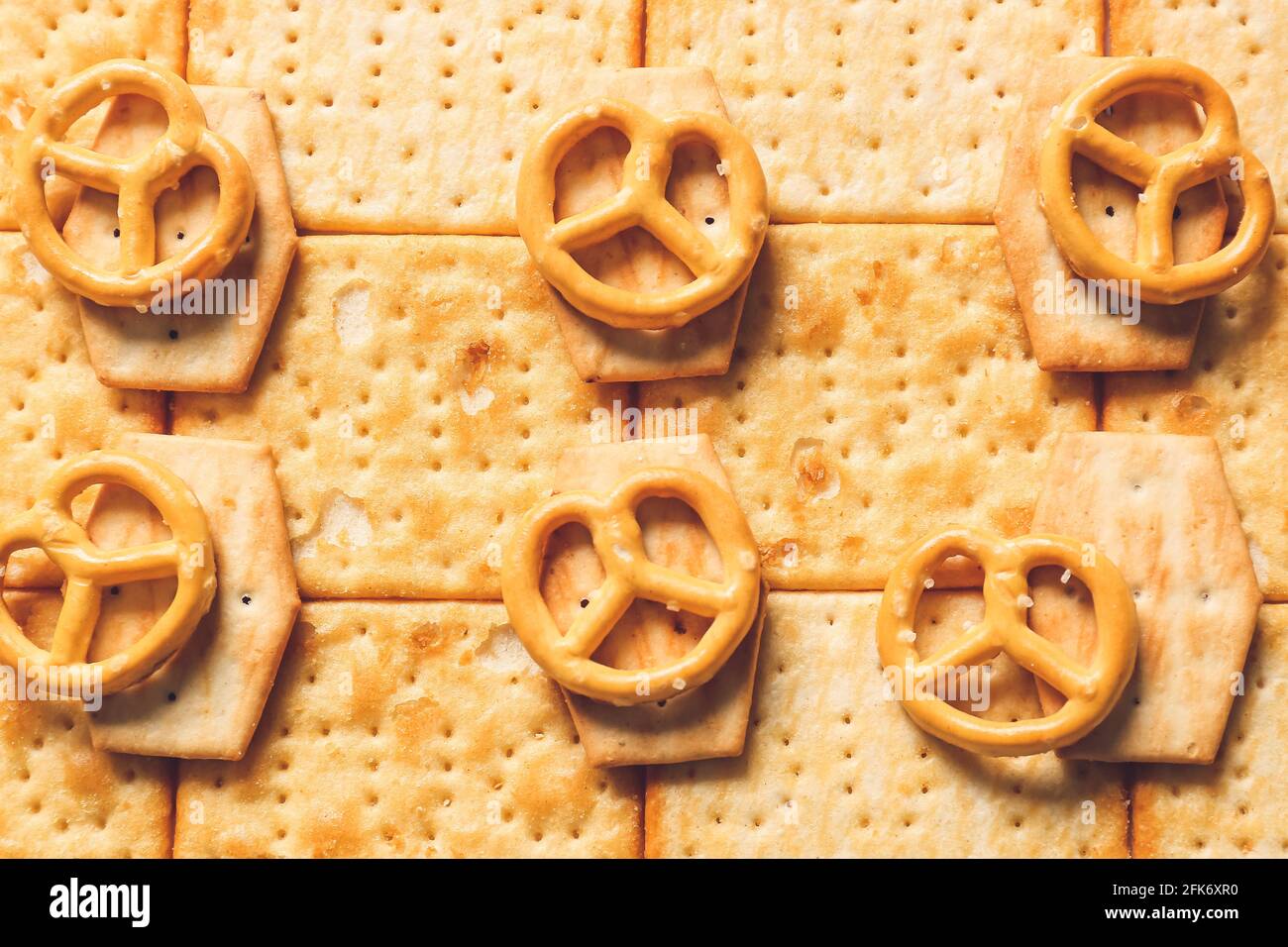 Tasty different crackers as background Stock Photo - Alamy