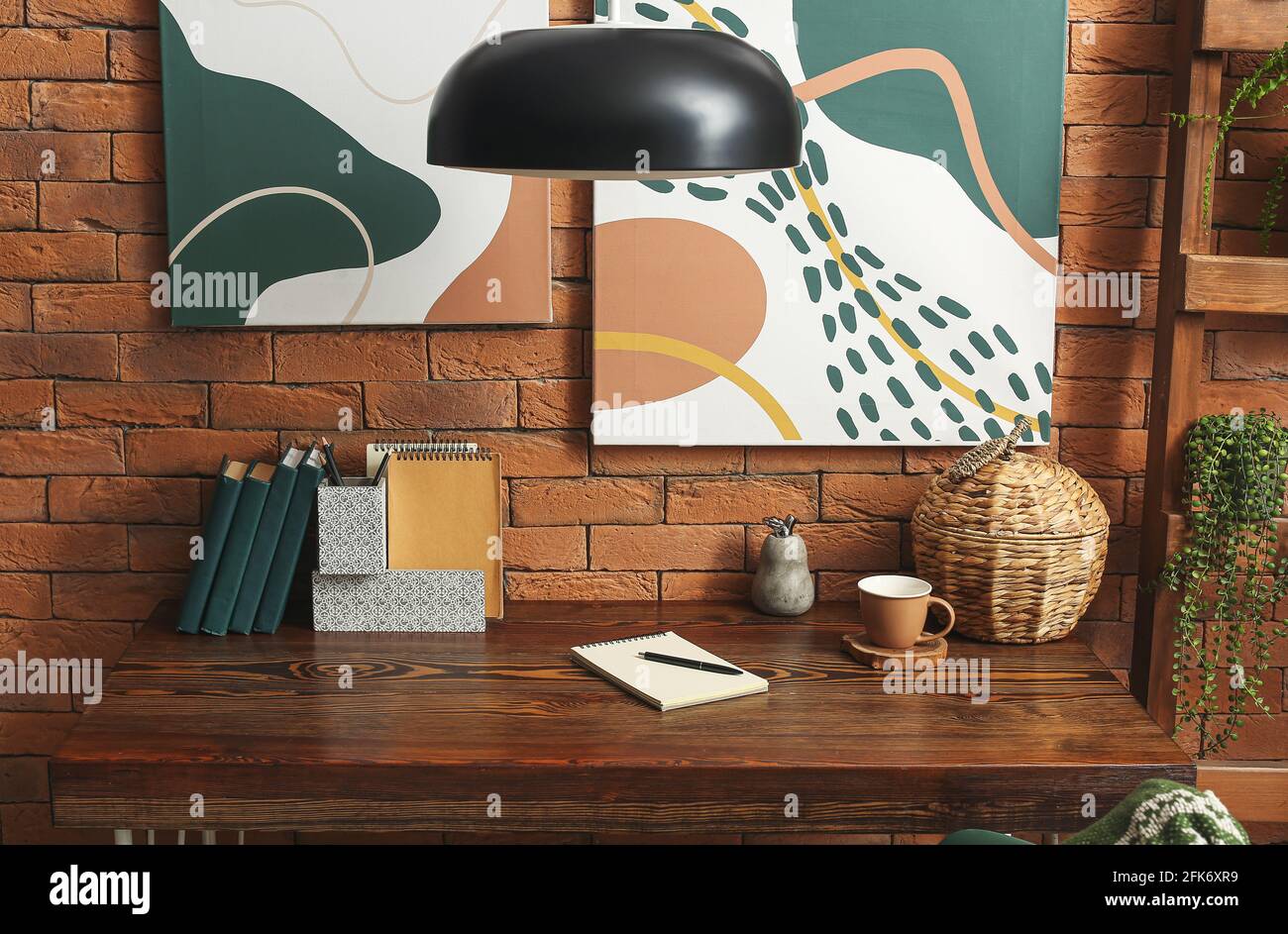 Stylish workplace in interior of room Stock Photo - Alamy