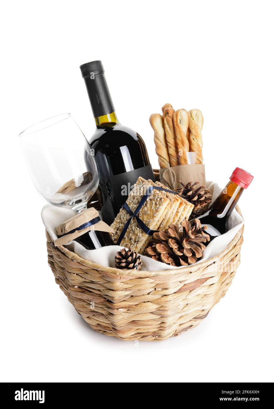 Gift basket with products and Christmas decor on white background Stock ...