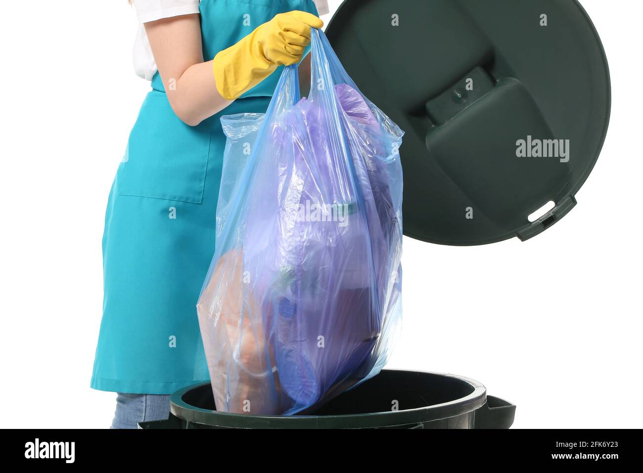 Janitor putting garbage in trash bin on white background Stock Photo ...