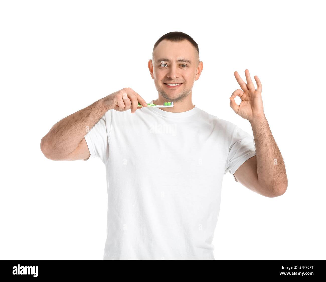 Man tooth brush showing hi-res stock photography and images - Alamy