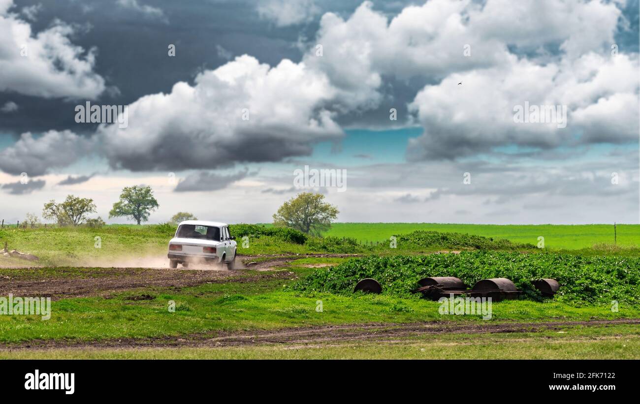 Driving car on dusty road hi-res stock photography and images - Alamy