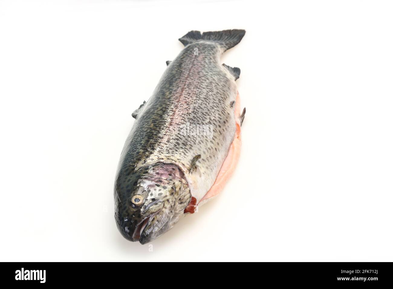 Raw trout fish isolated on white background Stock Photo - Alamy